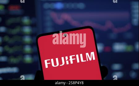 Fujifilm logo is displayed on smartphone. Fujifilm Holdings Corporation ...