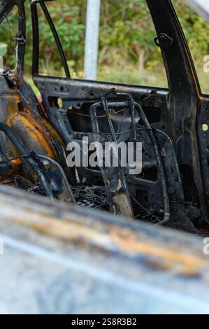 Broken and completely burned out car closeup Stock Photo - Alamy