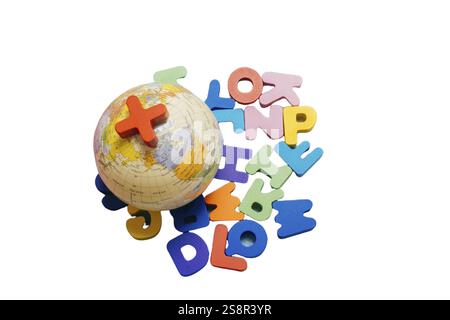 multi-colored wooden letters of the English alphabet on a beige ...