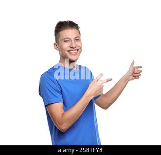 Happy man welcoming friends or guests on light blue background Stock ...