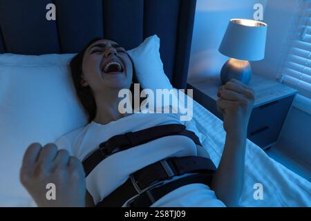 Woman in sleepwalking condition screaming in bed Stock Photo - Alamy