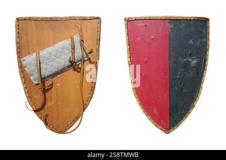 The front and back of a replica medieval shield, painted black and ...