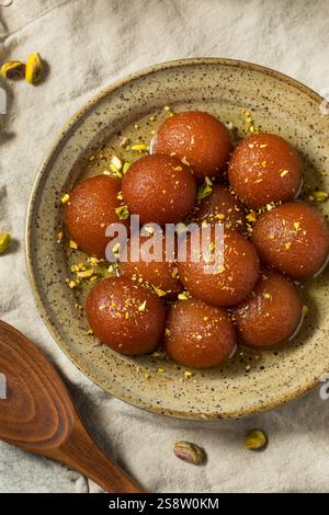 Gulab Jamun in red bowl on red background. Indian Dessert or Sweet Dish ...