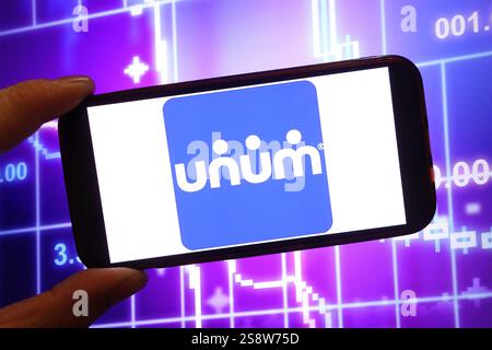 In this photo illustration, the Unum Group logo is seen displayed on a ...