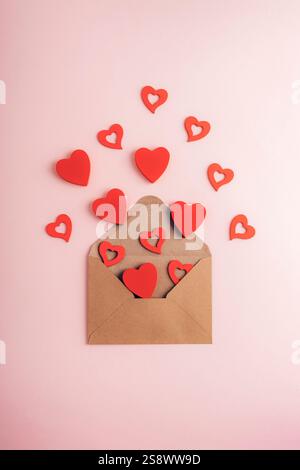 Envelope and red hearts on pink background. Valentine's day, love ...