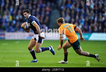 Blair Kinghorn of the British & Irish Lions runs into a tackled from ...