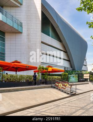 Baku, Azerbaijan - May 10 2024: Few people walk near the modern design ...