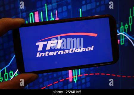 In this photo illustration, the TFI International company logo is seen ...
