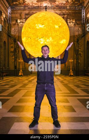 Artist Luke Jerram, with his work Helios, a seven-metre sun sculpture ...
