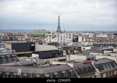 Detailed aerial view of Paris rooftops, apartment blocks, and a modern ...