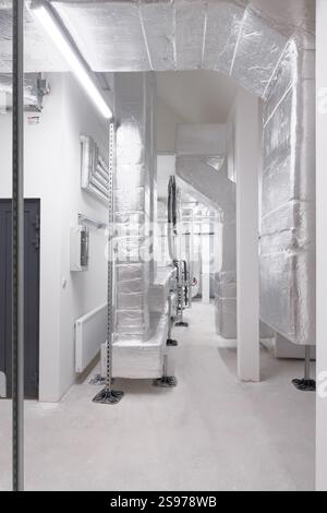 Mechanical Room with Insulated Pipes and Ductwork Stock Photo - Alamy