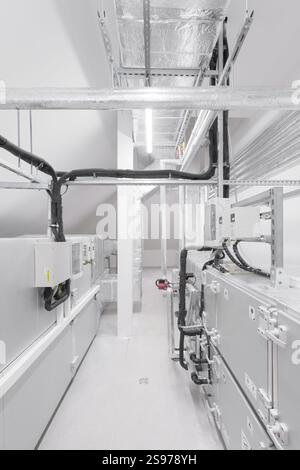 Mechanical Room with Insulated Pipes and Ductwork Stock Photo - Alamy