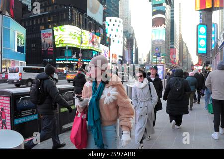 People walk in Times Square, Manhattan, New York City. (Photo by Jimin ...