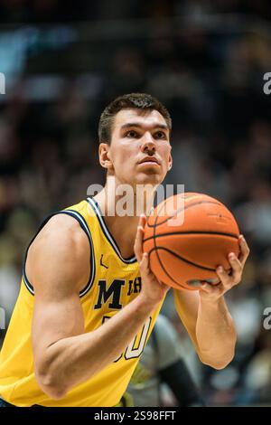 Michigan center Vladislav Goldin (50) os guarded by Purdue forward ...