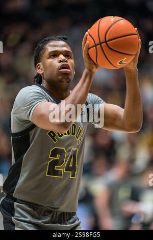 Purdue guard Gicarri Harris (24) makes a pass around Nebraska forward ...