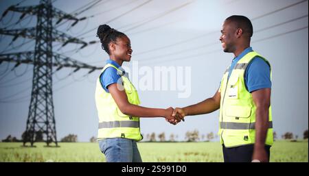 Electrician Workers Shaking Hands Near High Voltage Circuit Line Tower ...