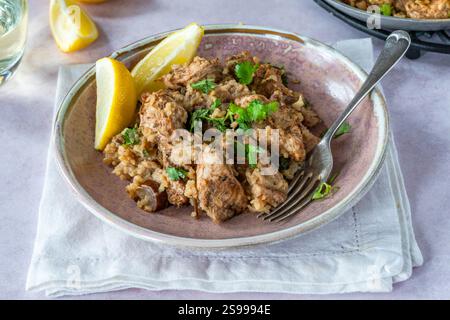 Spiced chicken and date pilaf Stock Photo - Alamy