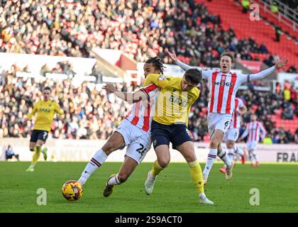 Stoke City's Ashley Phillips (left) and Middlesbrough's Tommy Conway ...