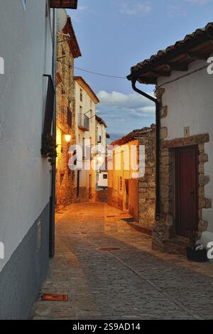 Streets of the old town centre of Ares in Spain. Evening time. Darkness ...