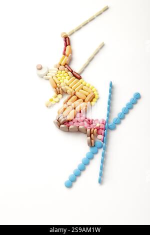Doping drugs and pills in the shape of a road bicycle racer on a bike ...