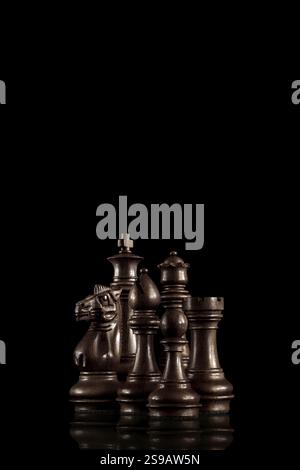 Chessboard with figures on dark background Stock Photo - Alamy