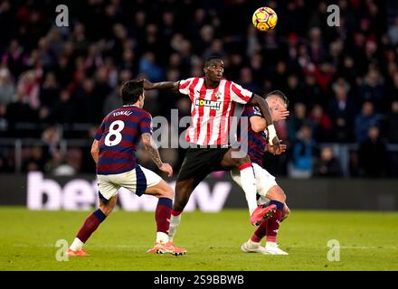 Southampton's Paul Onuachu (centre) battles for the ball with Chelsea's ...