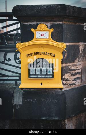 Postbriefkasten - Vintage yellow German letter box Stock Photo - Alamy