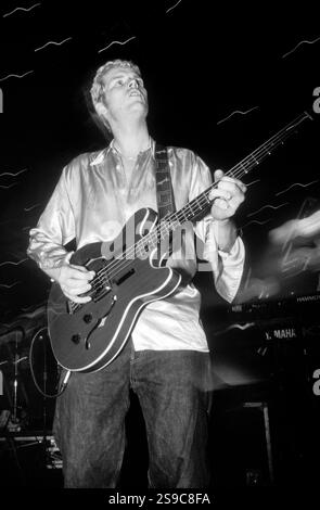 Nigel Clark singer and bass player with Britpop band Dodgy playing at ...