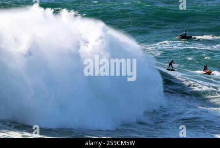 NAZARE, PORTUGAL - JANUARY 25: James Carew of Australia riding a wave ...
