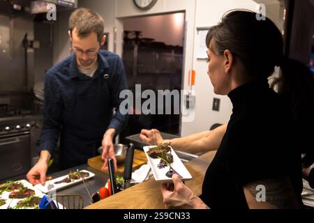 Chef interacting with customer Stock Photo - Alamy