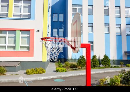 Facade of kindergarten building. Colorful playground for childrens on a ...