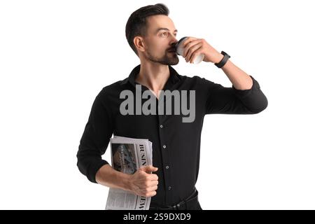 Young stylish businessman with newspaper drinking coffee on backseat of ...