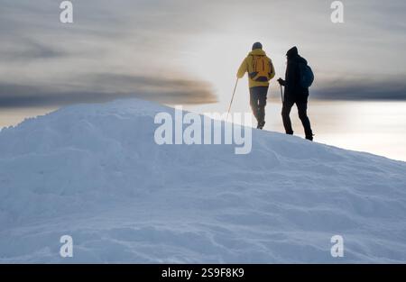 Colorful silhouette of skier standing on slope, Kasprowy Wierch Peak in ...