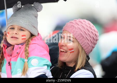 Fans watch an alpine ski men's downhill race, at the 2026 Winter ...