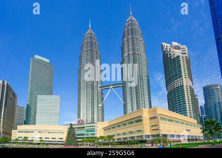 Drone shot of the spire of a high rise building with a golden five ...