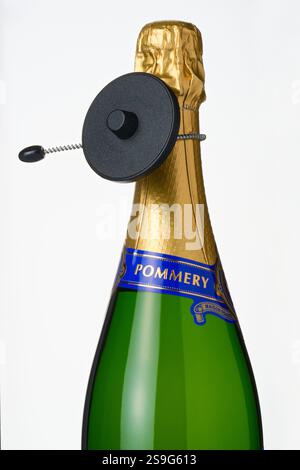 Wine bottle with a security tag fixed to the neck Stock Photo - Alamy