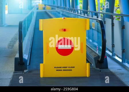 Passage is prohibited on a travellator, an elevated pedestrian crossing ...