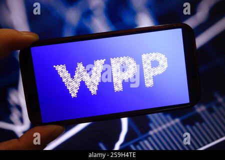 In this photo illustration, the WPP plc company logo is seen displayed ...