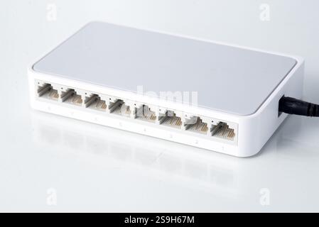 Ethernet network switch with eight ports on a clean background, used ...