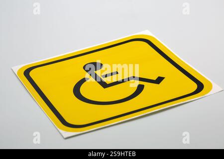 Studio shoot of yellow disability sign for placement on a vehicle ...