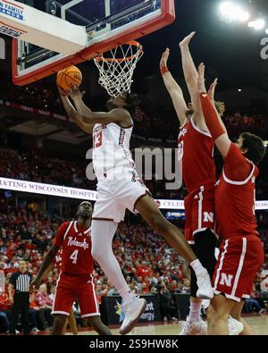 Wisconsin forward Xavier Amos (13) reacts to a three-point basket ...