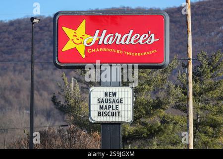 The Hardee's logo is seen on a sign outside of the fast food restaurant ...