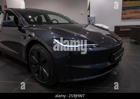 sleek midnight-black Tesla Model 3, futuristic headlights and iconic ...