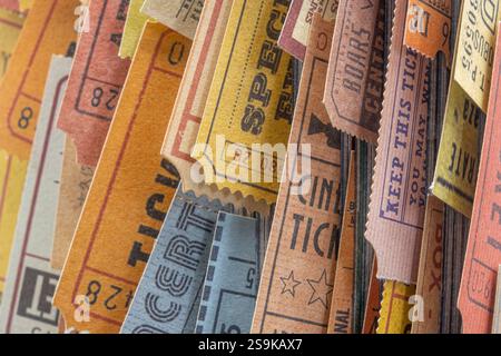 Old tickets stuck between the pages of a rolled-up magazine Stock Photo ...
