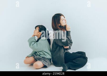 Thinking parents and children Stock Photo - Alamy