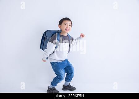 Primary schools boy running away Stock Photo - Alamy