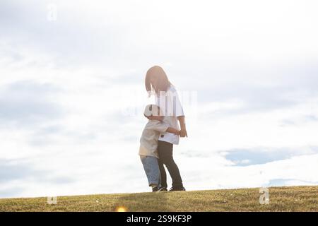 Child hugging her mother Stock Photo - Alamy