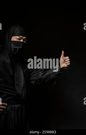 Ninja with thumbs up Stock Photo - Alamy