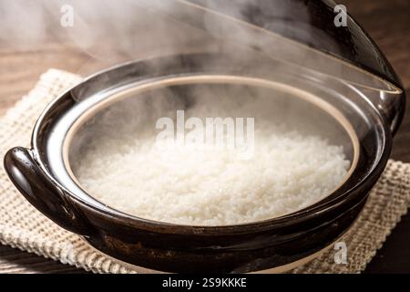 Rice cooked in earthenware pot Stock Photo - Alamy