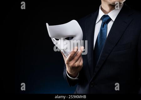 Masked man in suit Stock Photo - Alamy